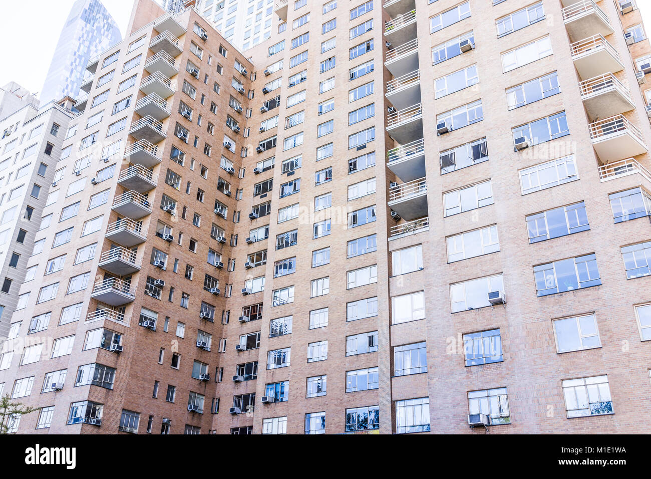 Residential apartment brownstone brick building skyscraper exterior in ...