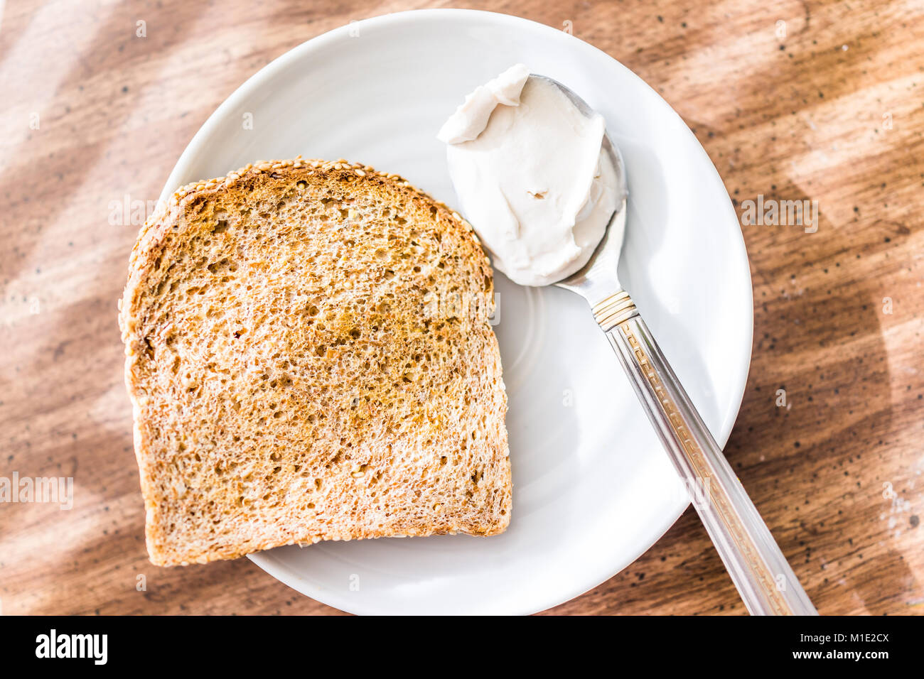 Closeup of slice piece of whole wheat sprouted toasted grain bread on ...