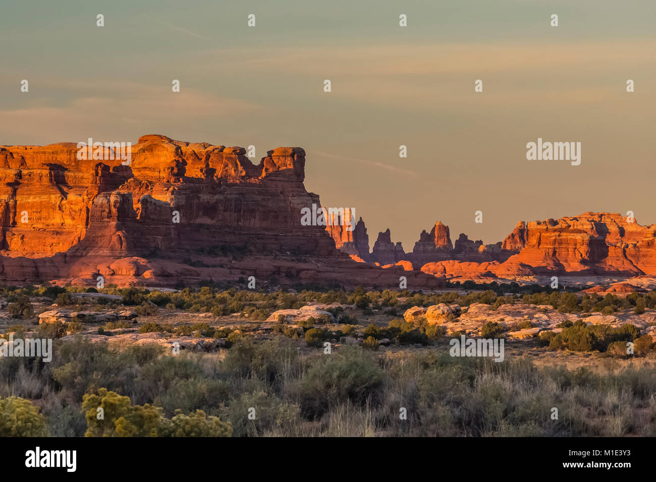 Rising sun kissing the rock formations in The Needles District of ...
