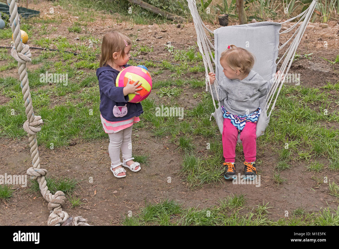 Cousins Playing in the Yard on a Summer Day Stock Photo - Alamy