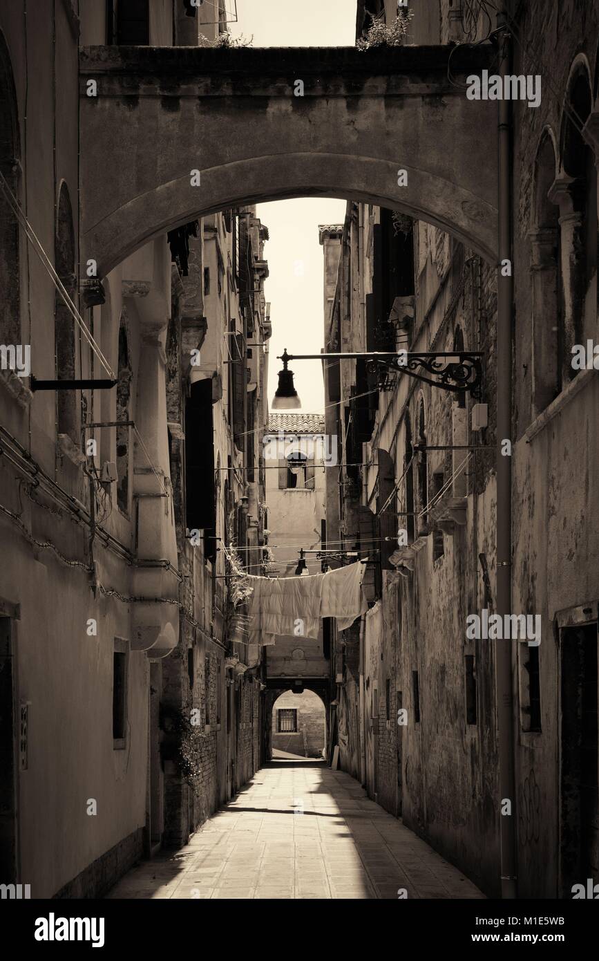 Alley view with arch and historical buildings in Venice, Italy Stock ...