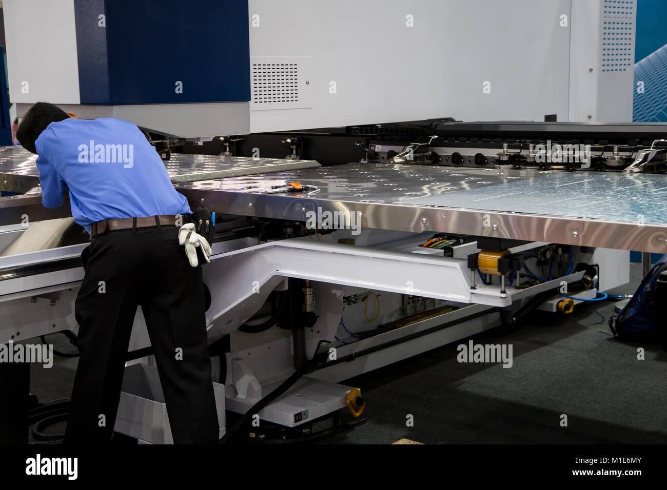 Mechanic worker repair CNC laser cutting machine Stock Photo - Alamy
