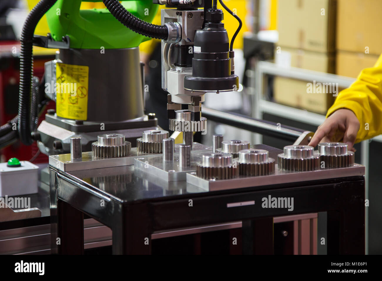 Worker operating 2D sensor robotic assembly machine Stock Photo - Alamy