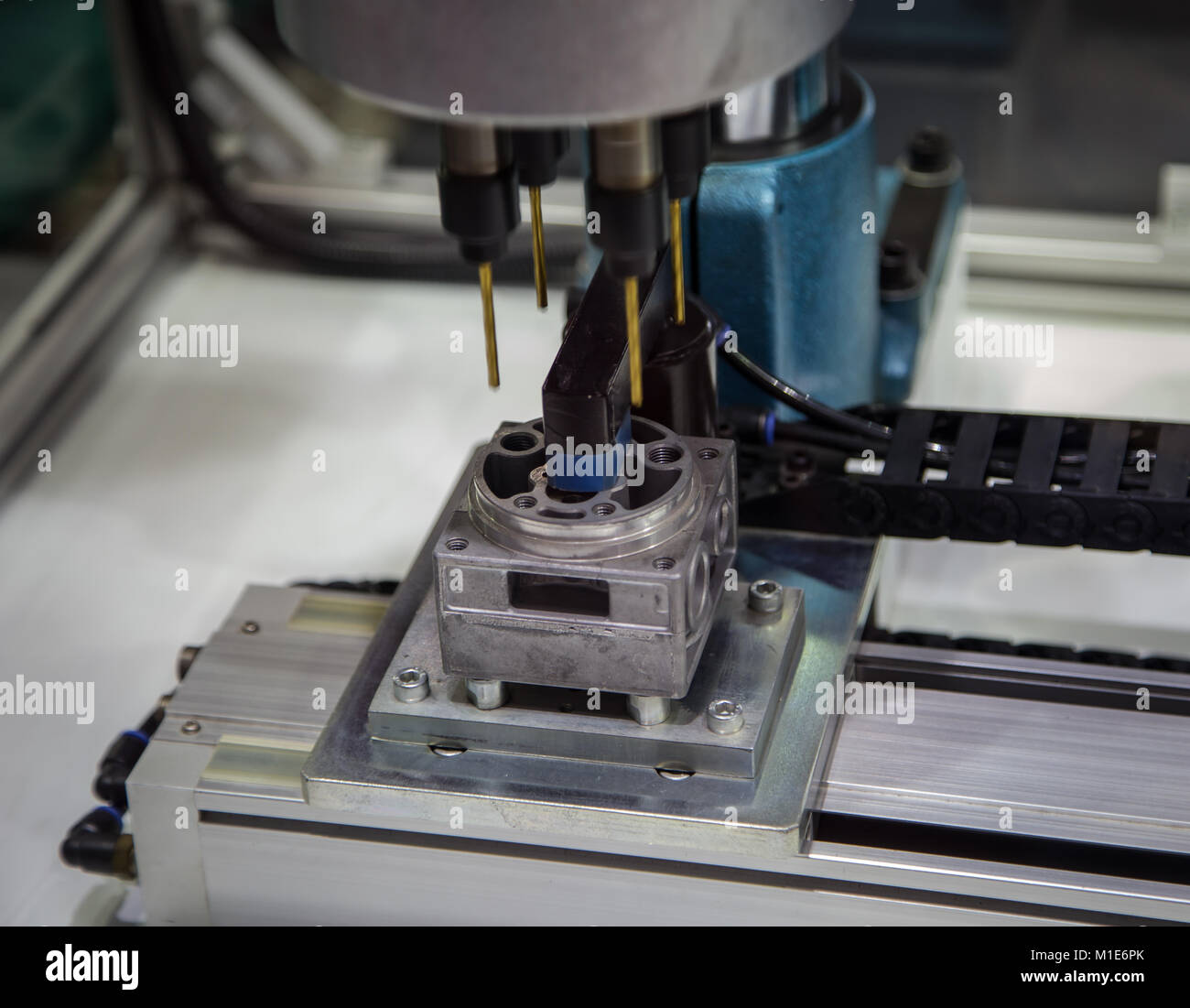 CNC milling machine drilling engine part Stock Photo - Alamy