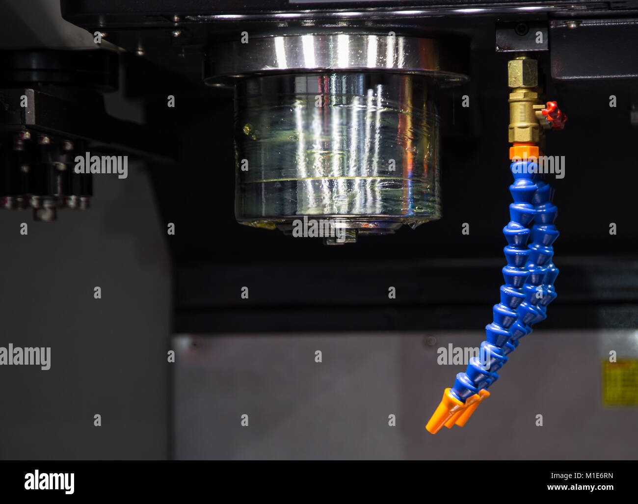 Chuck and coolant nozzle on CNC milling machine Stock Photo - Alamy