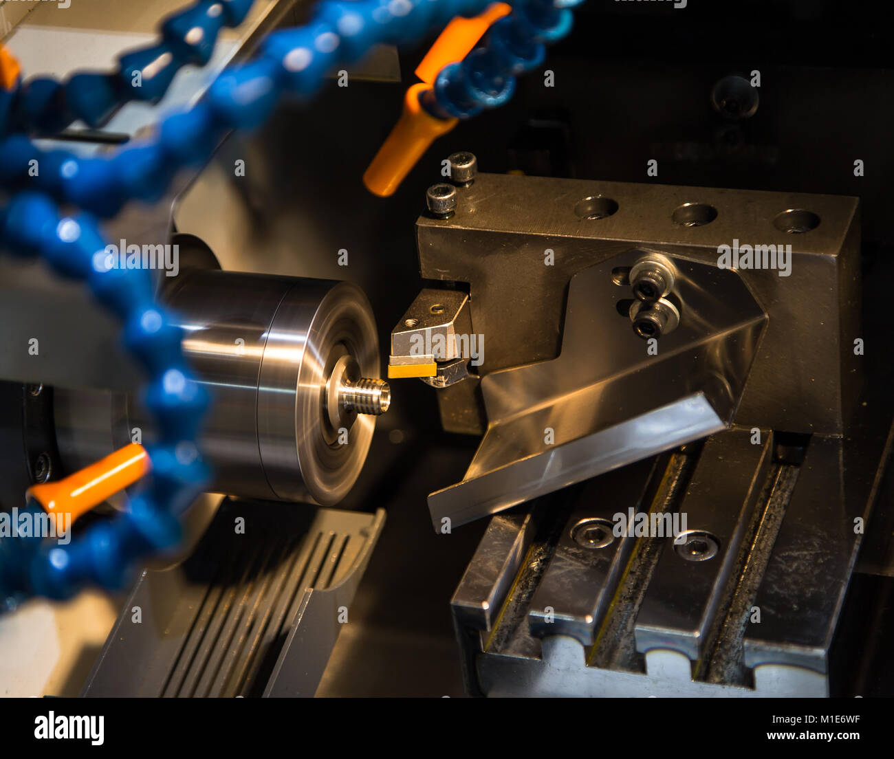Thread cutting on CNC lathing machine Stock Photo - Alamy