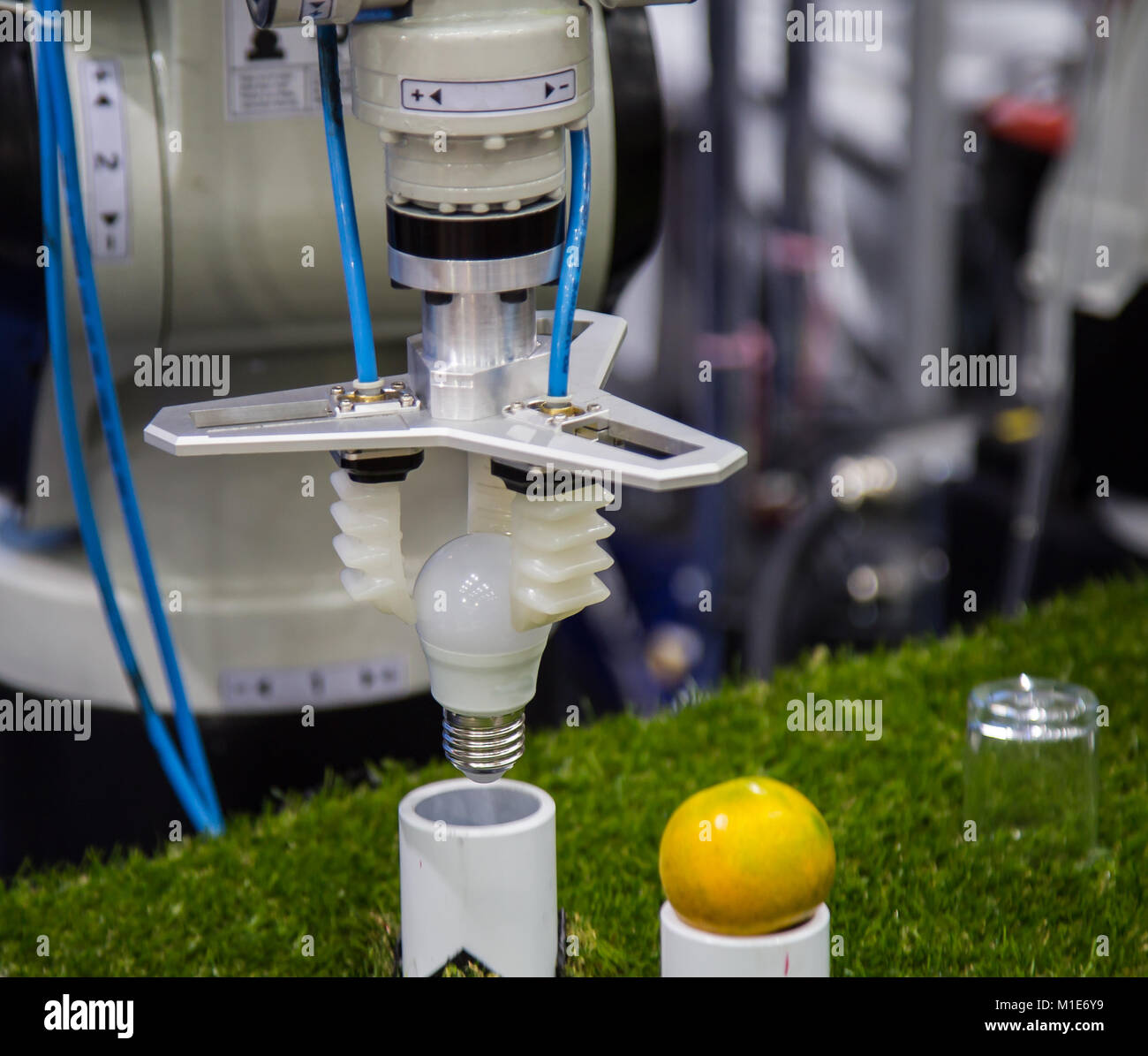 Robotic arm demonstration lifting light bulb and put on pipe Stock ...