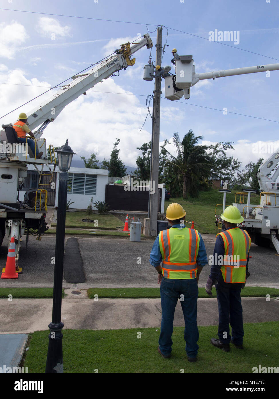 Linemen from the Puerto Rico Electric Power Authority office in Rio ...