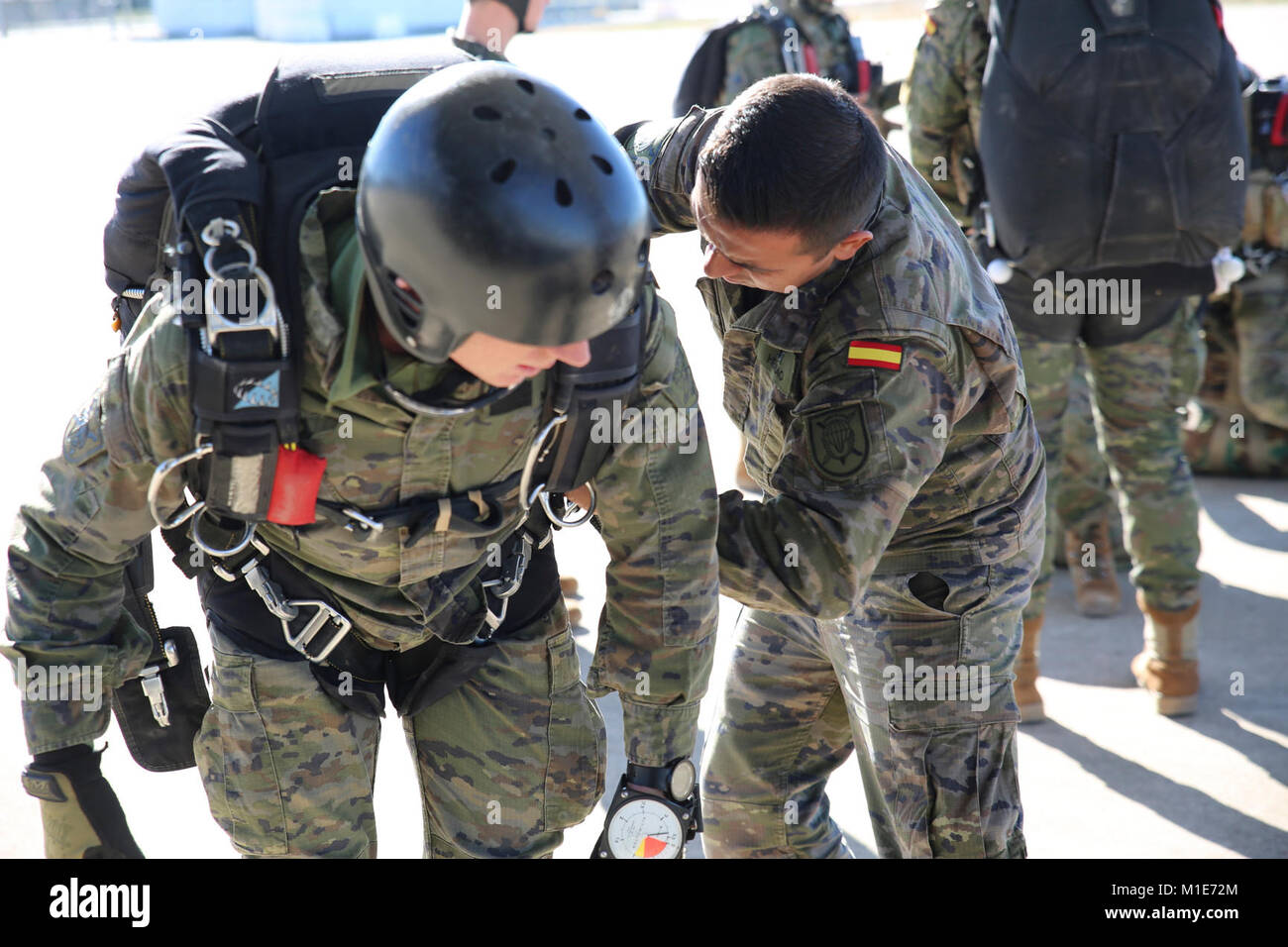A Spanish paratrooper inspects a parachute during Operation Death From ...