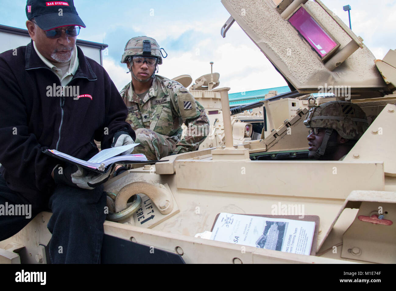 (From Left) A Department of Defense employee, Spc. Dorian Thomas and ...