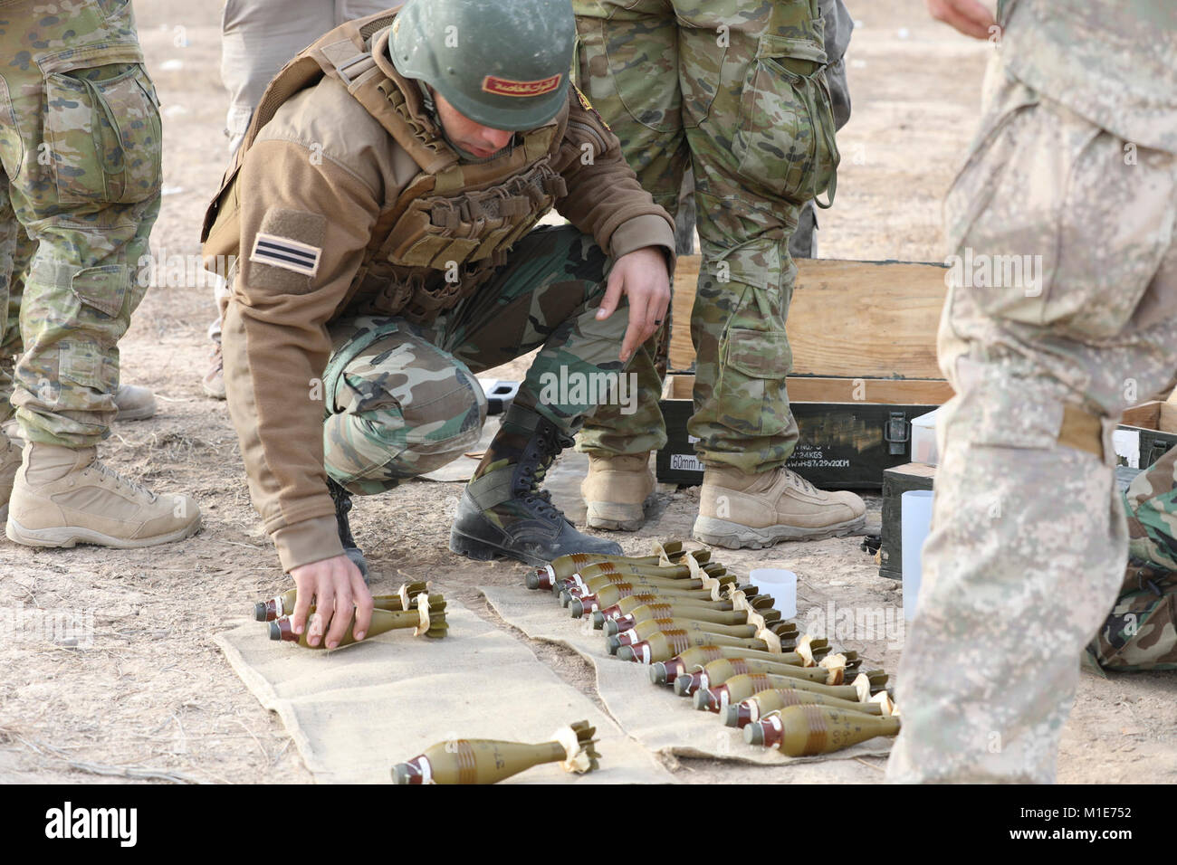 A Qwat Khasa member of the Iraqi army prepares 60mm mortars rounds in ...