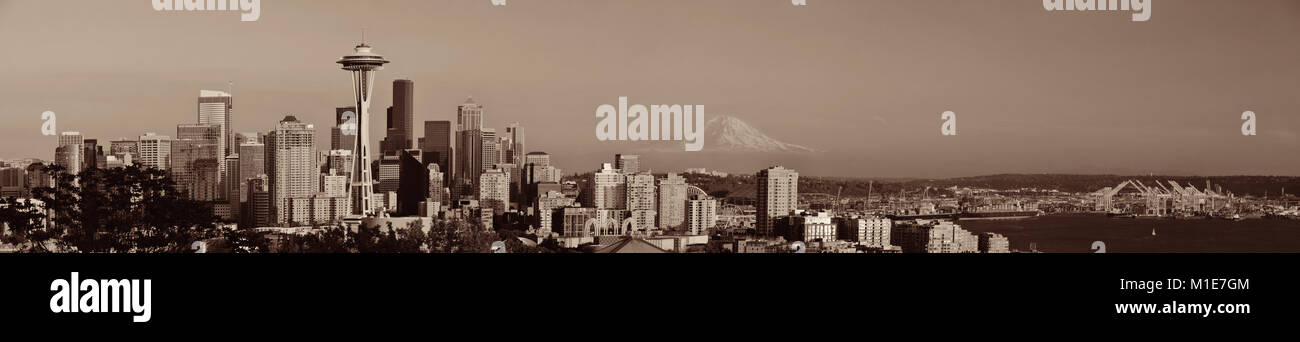Seattle city skyline with Mt Rainier at sunset with urban office ...