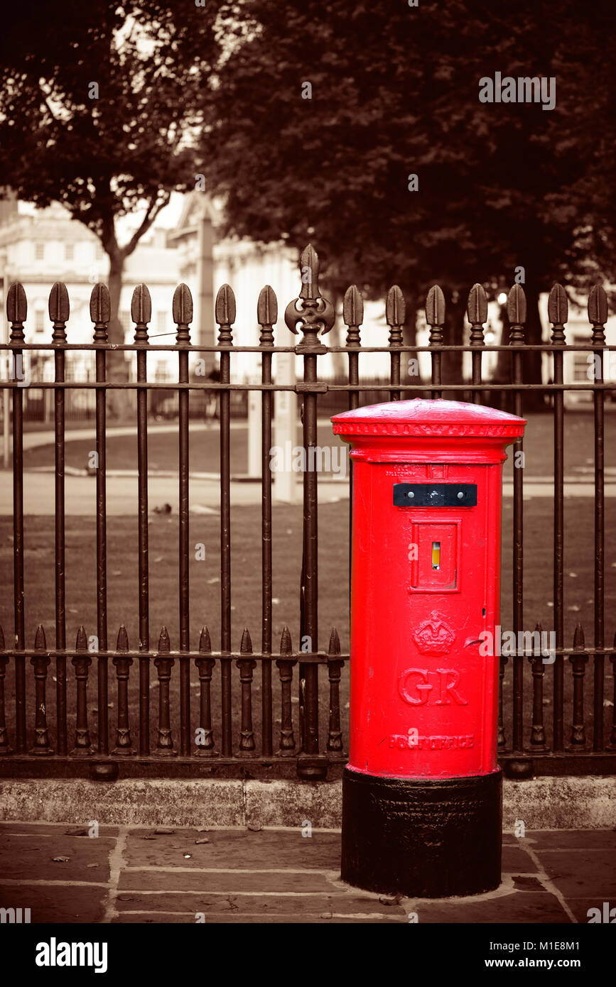 Red post box in street with historical architecture in London Stock ...