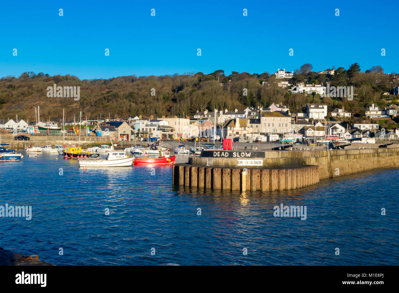 Lyme Regis Dorset England March 31, 2016 Early morning at the Cobb, the ...