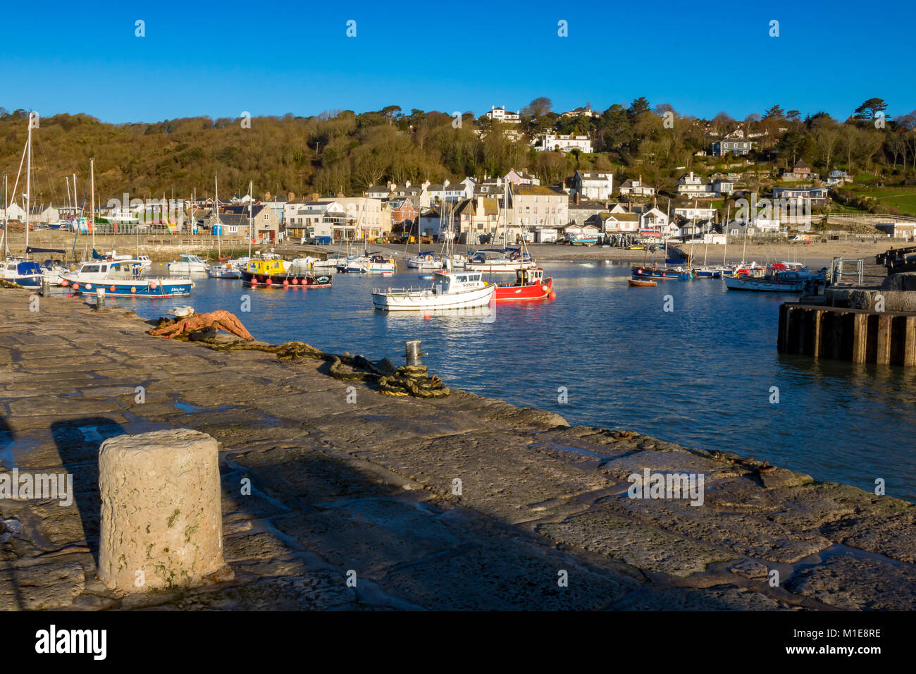 Lyme Regis Dorset England March 31, 2016 Early morning at the Cobb, the ...