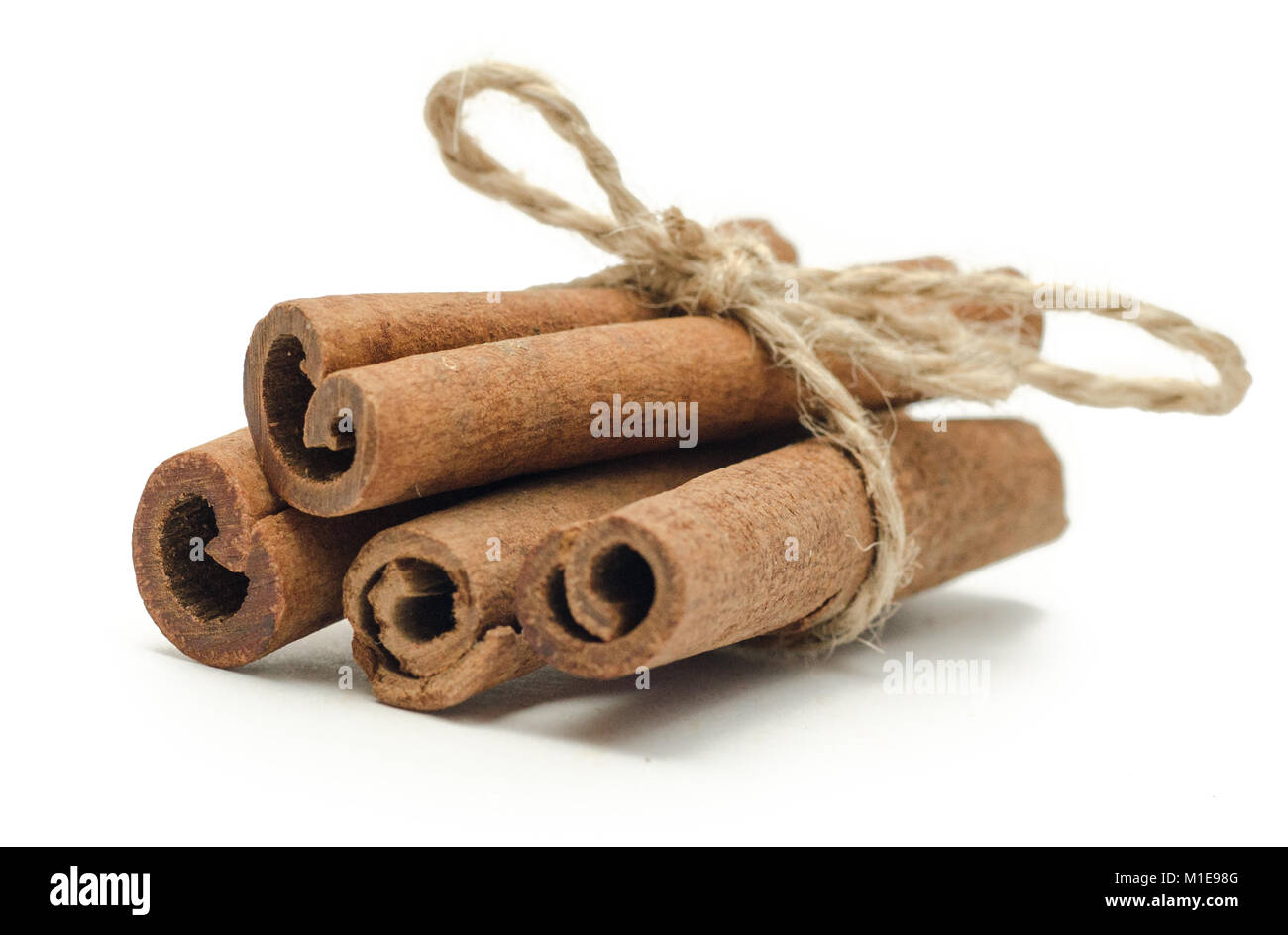 Group cinnamon, close up, isolated on white background Stock Photo - Alamy