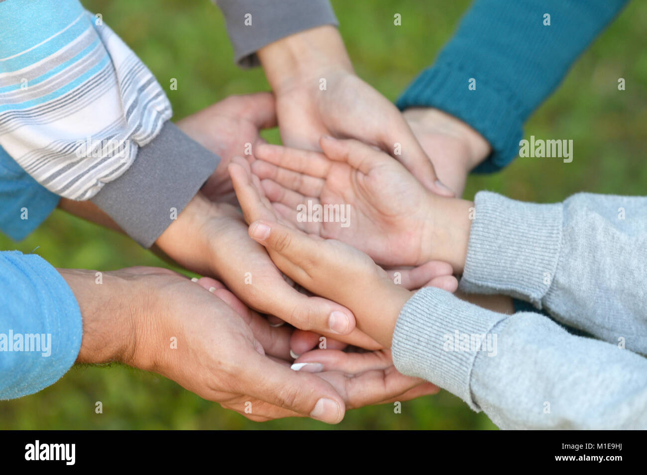 Hands held together Stock Photo - Alamy