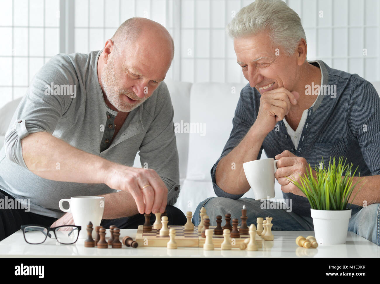 senior men playing chess Stock Photo - Alamy