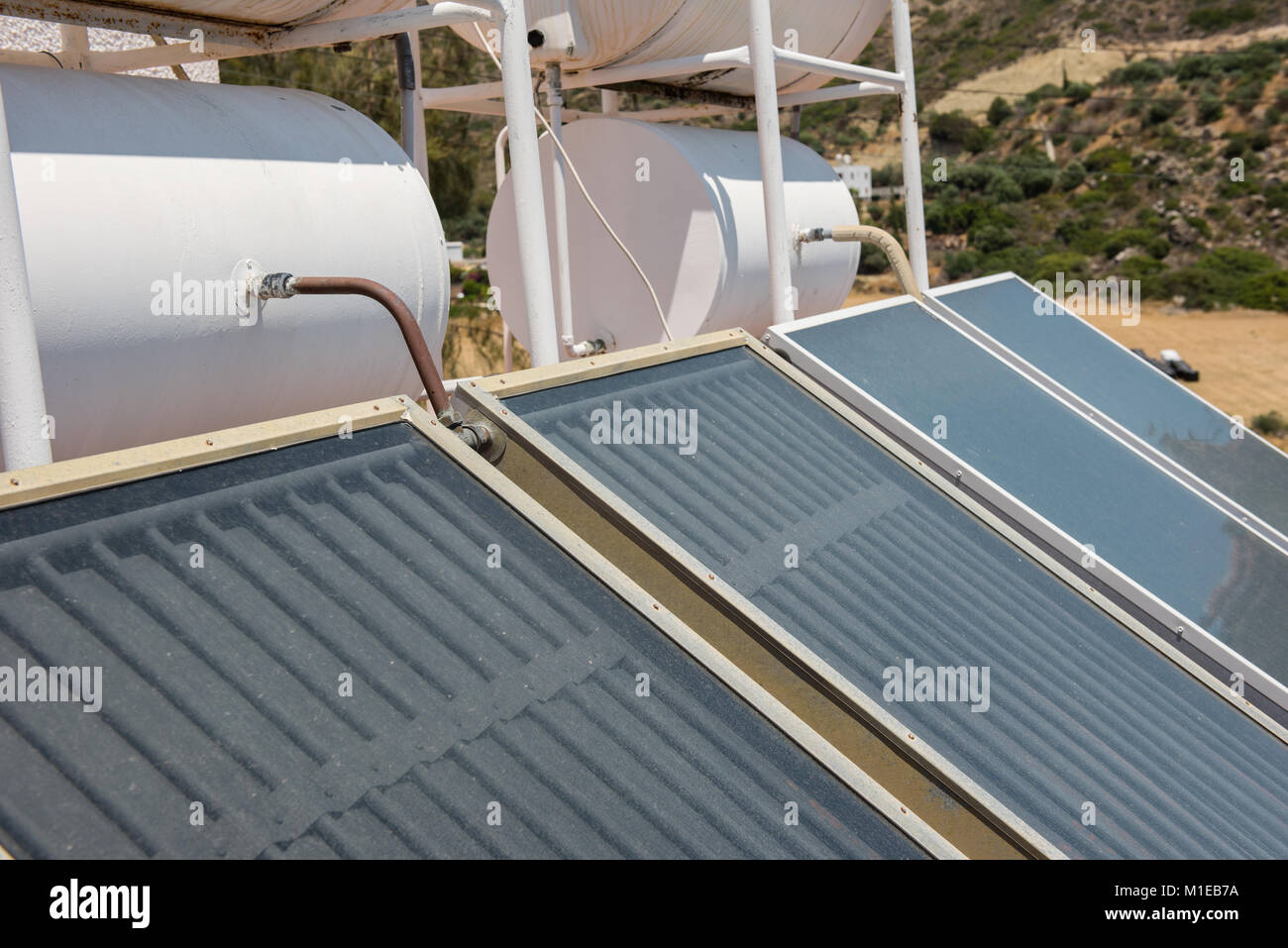 Solar panel hot water system on the roof Stock Photo - Alamy