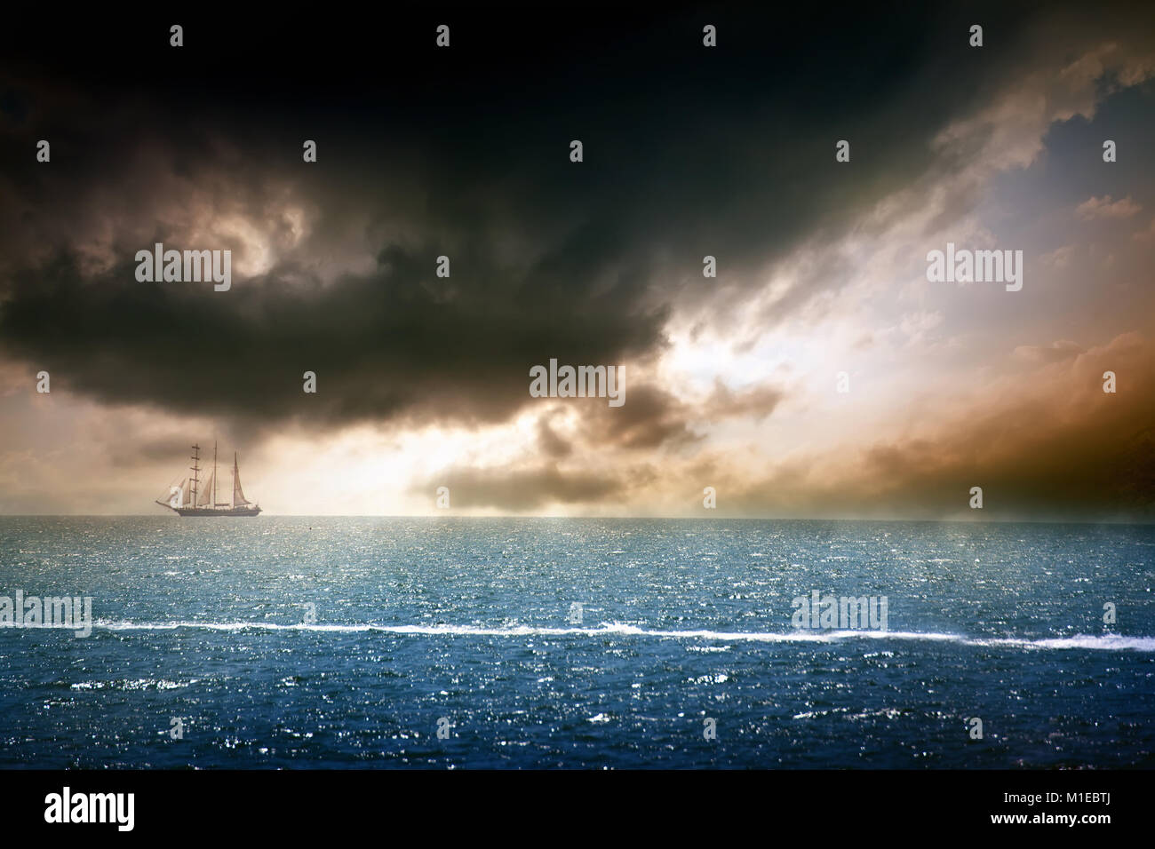 stunning sea HDR sunset with boat at the horison Stock Photo - Alamy