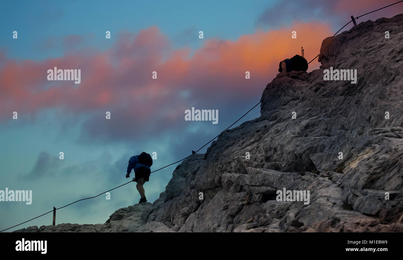 high mountain climber in stunning HDR red sunset Stock Photo - Alamy