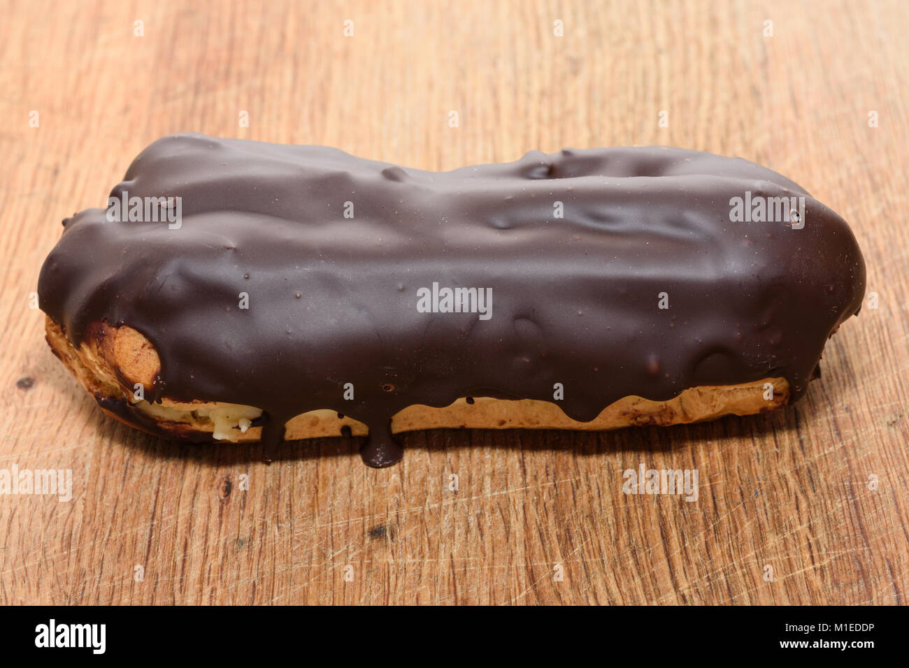 eclair on wood board Stock Photo - Alamy