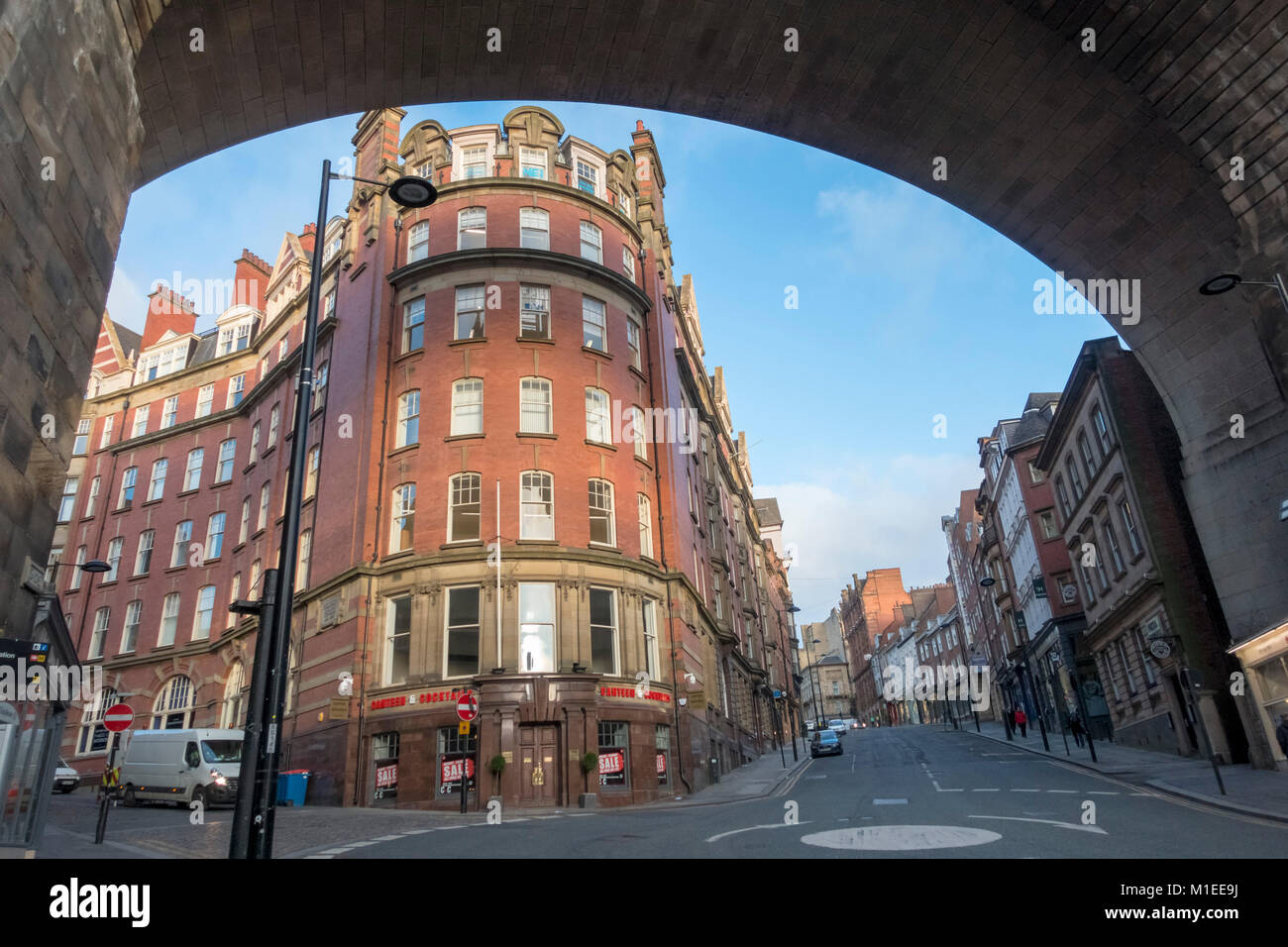 Looking up Dean street, Newcastle upon Tyne, under a high railway arch ...