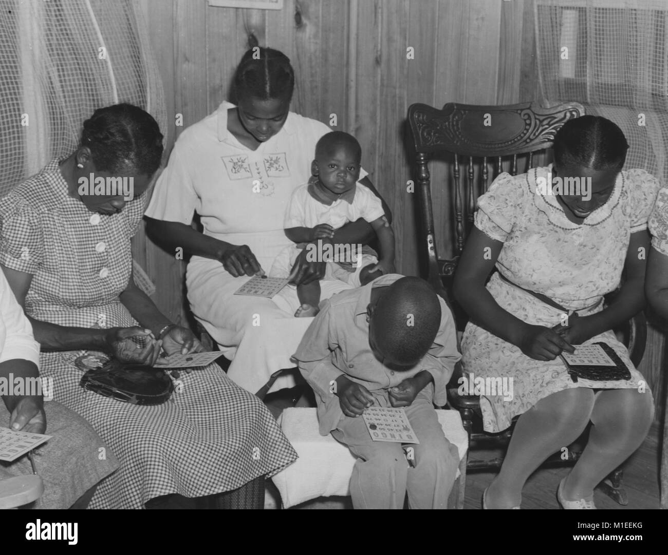 African-American mothers with children gathered to play bingo, Madison ...