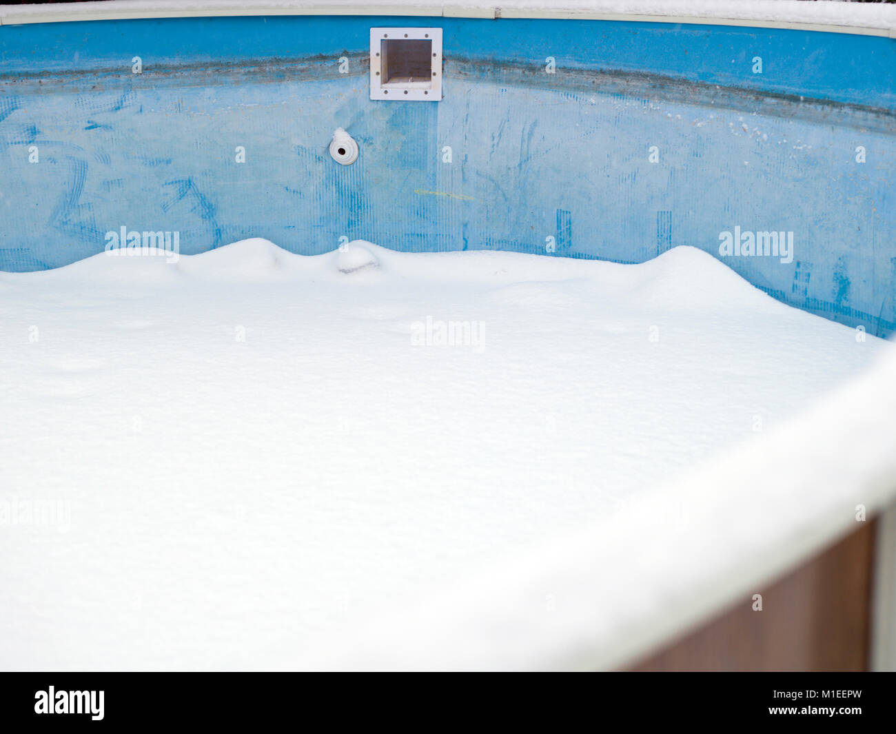 Outdoor swimming pool covered with ice and snow Stock Photo - Alamy