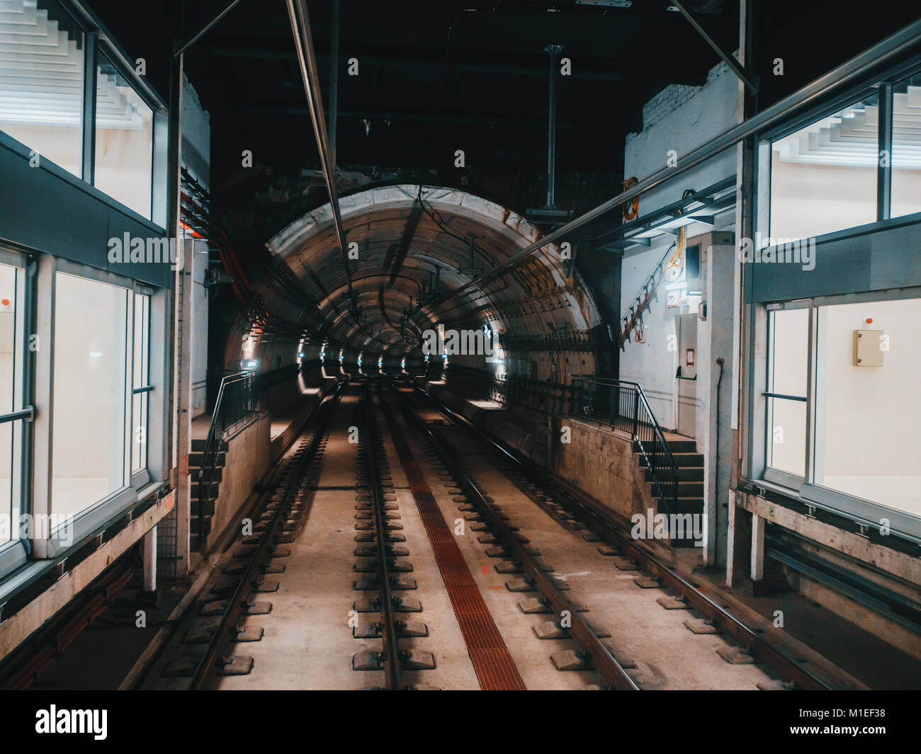 View of a subway tunnel from the front of a moving train. Fast ...