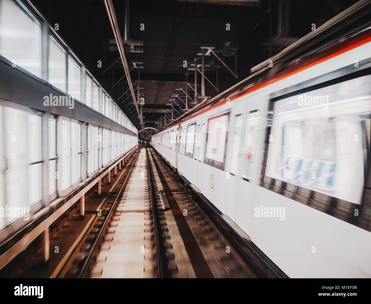 View of a subway tunnel from the front of a moving train. Fast ...