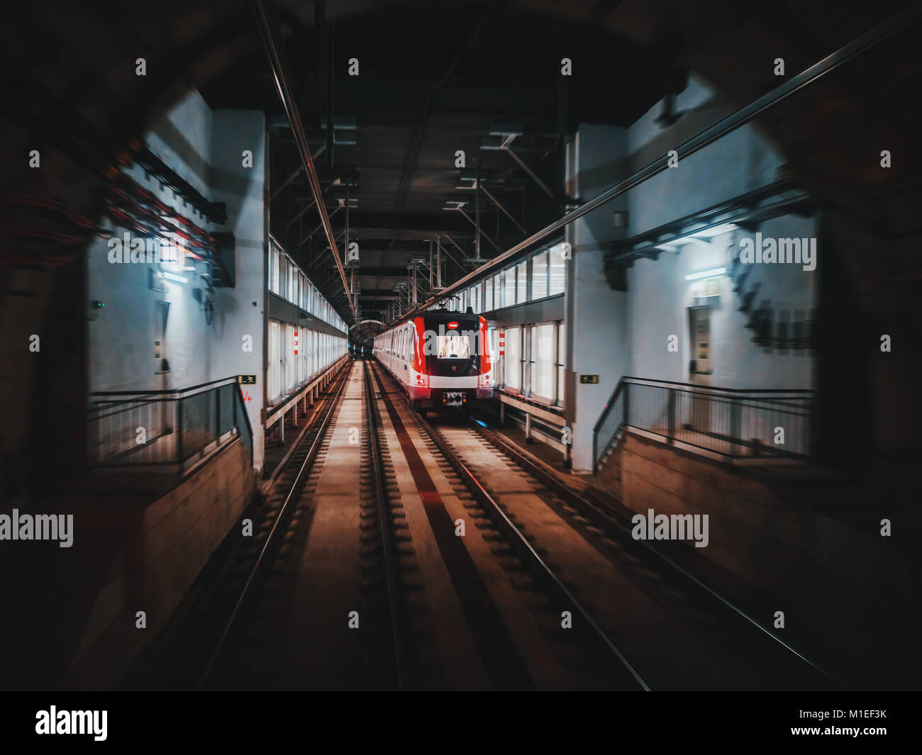View of a subway tunnel from the front of a moving train. Fast ...