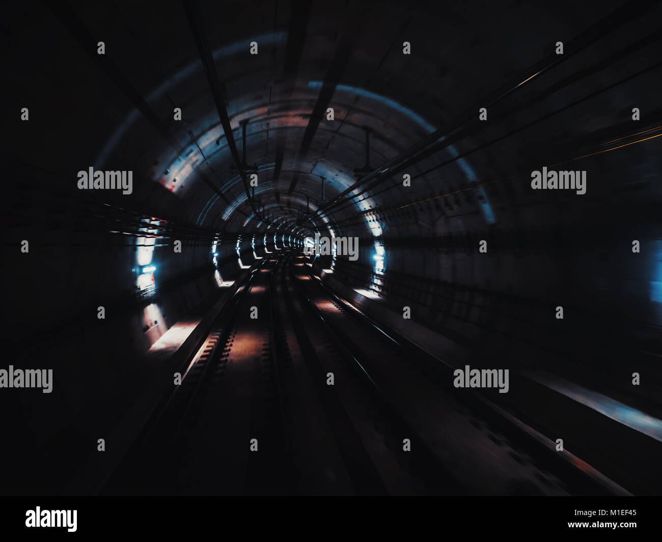 View of a subway tunnel from the front of a moving train. Fast ...