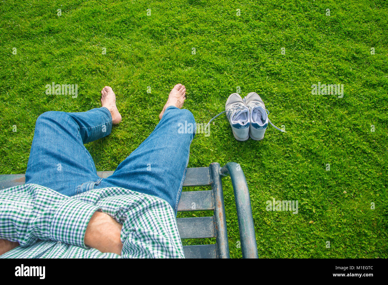 Man sitting on a bench, taking a rest. View from above Stock Photo - Alamy