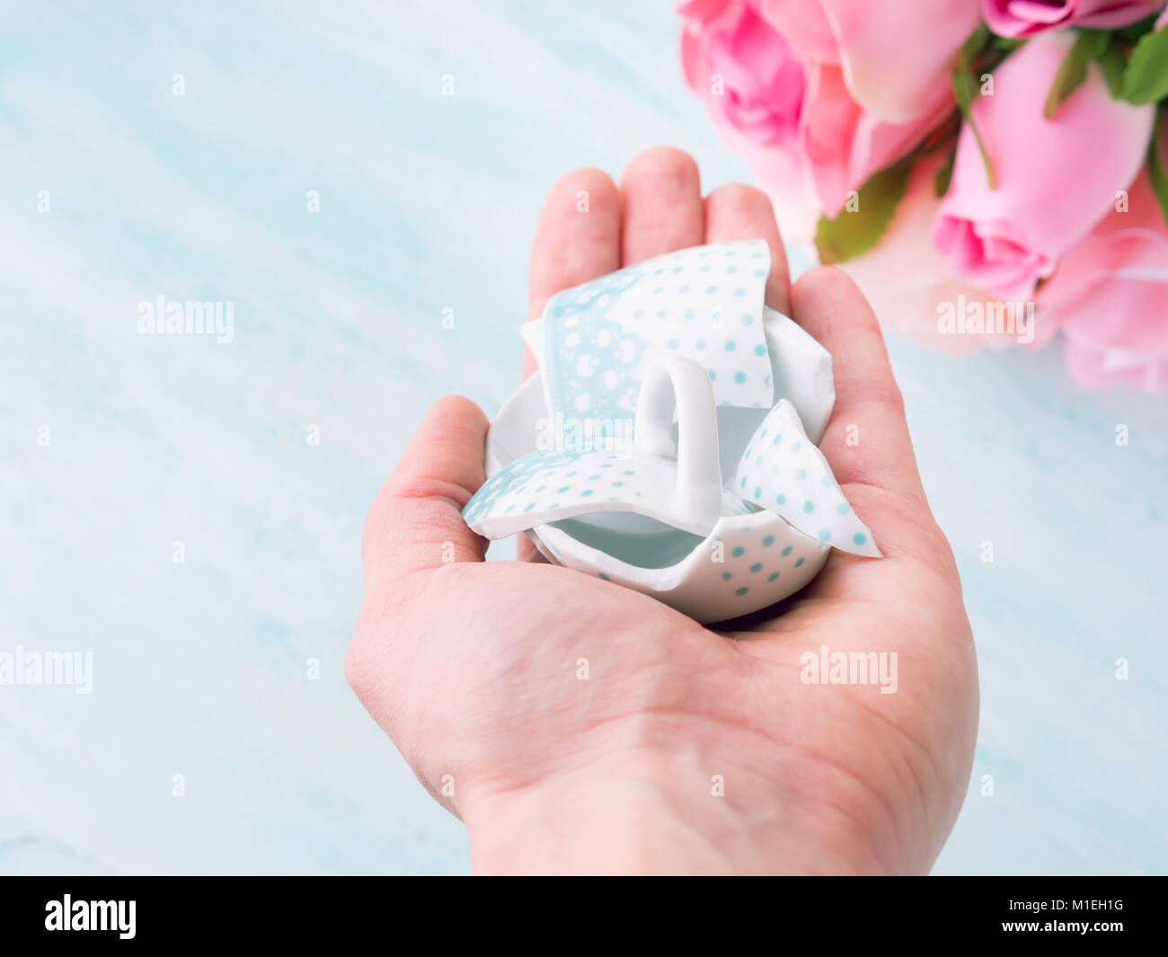 Broken cup in woman's hand - broken relationship concept Stock Photo ...