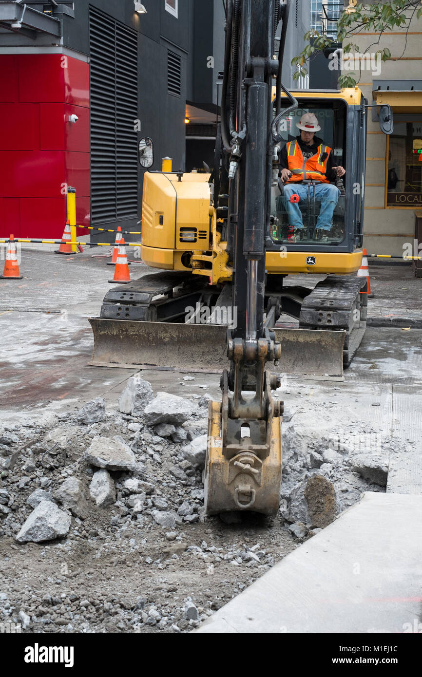 Backhoe city street hi-res stock photography and images - Alamy