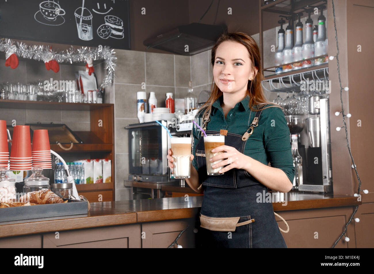 woman making coffee by coffee machine in coffee shop cafe. Food and ...