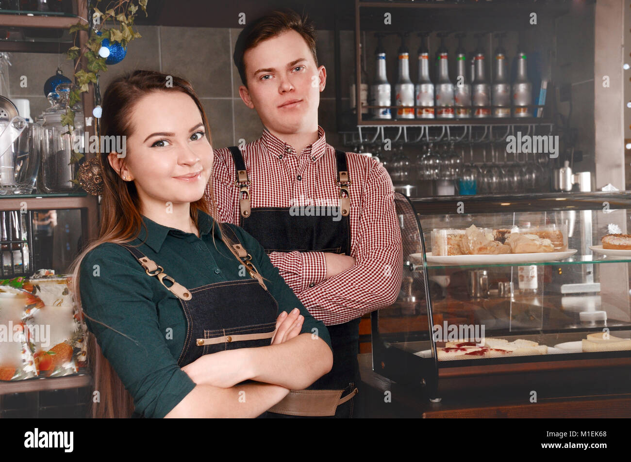 Couple barista standing side hi-res stock photography and images - Alamy