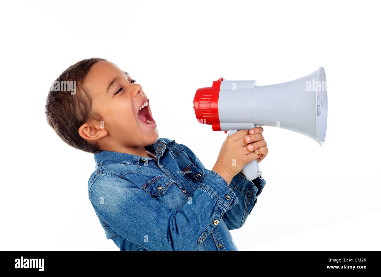Small boy shouting through a megaphone isolated on white background ...
