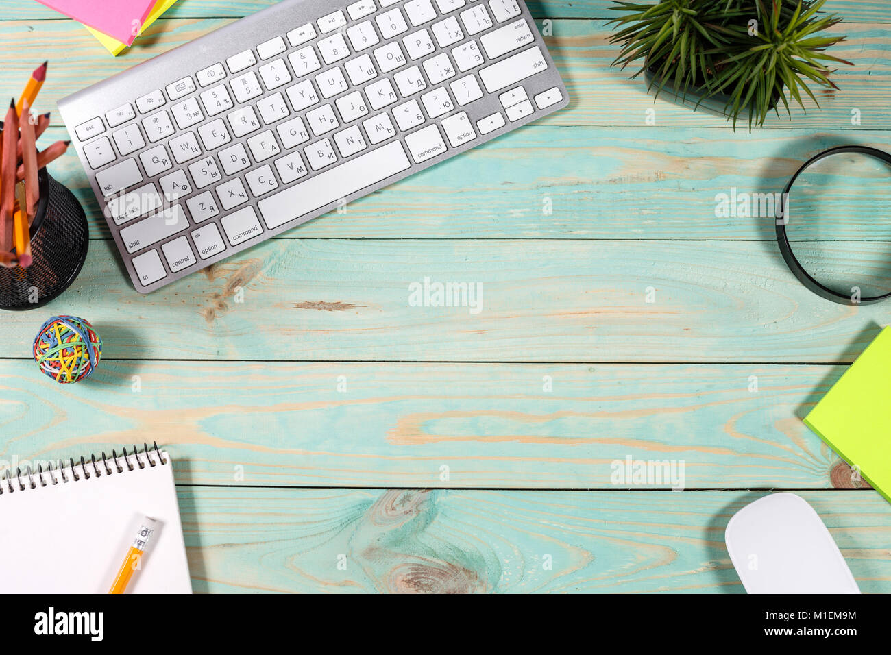 Modern green wooden office desk with laptop computer. Minimal concept ...