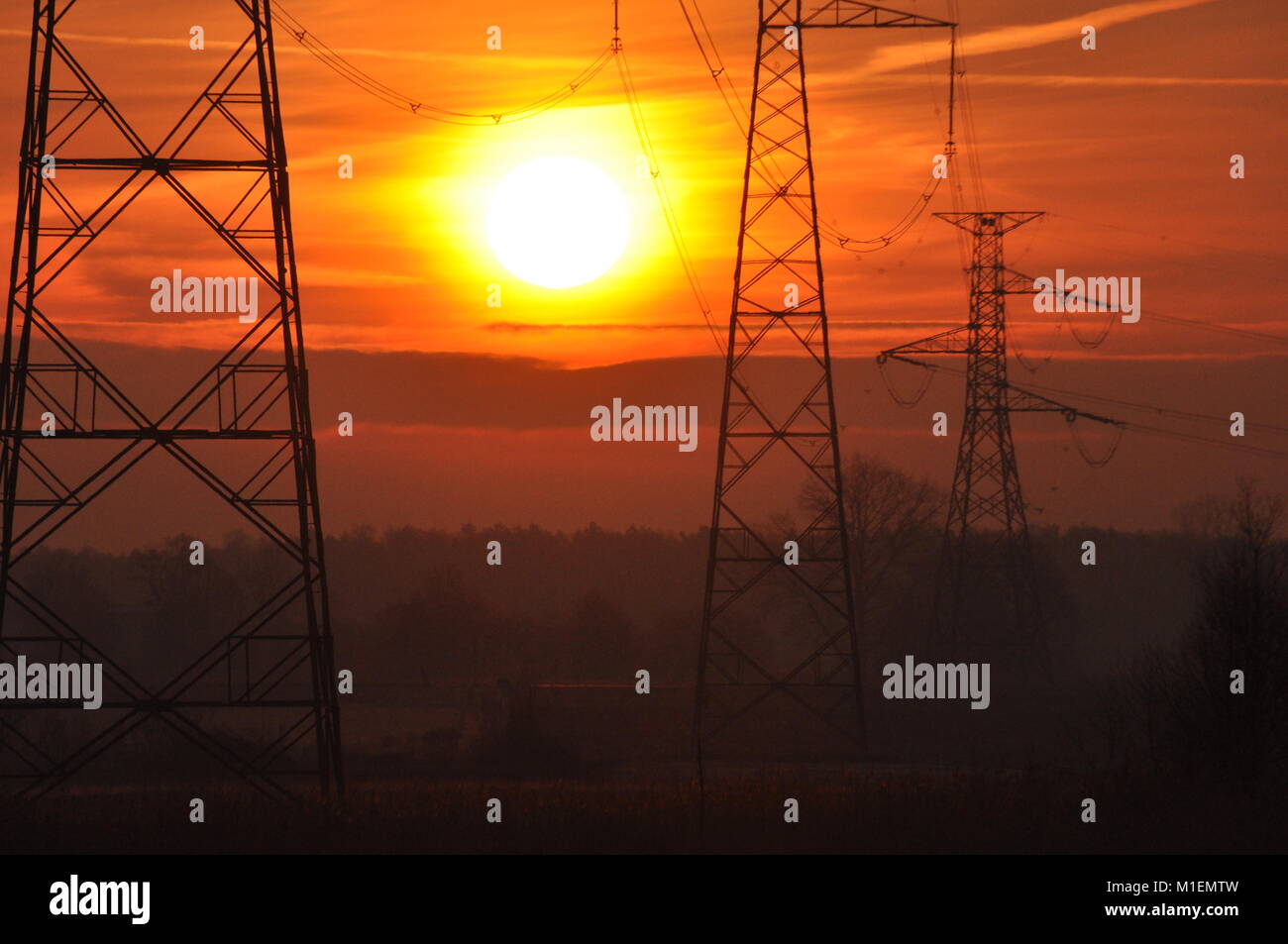 Sunrise. Sunny morning. Line of high-voltage wires and poles Stock ...