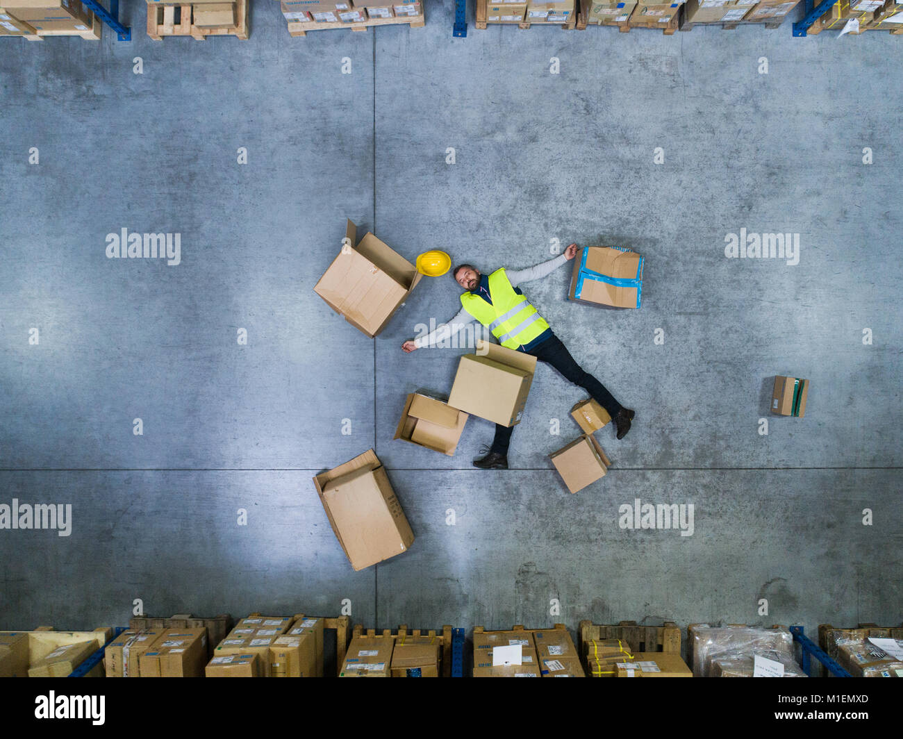 Warehouse worker after an accident in a warehouse Stock Photo - Alamy