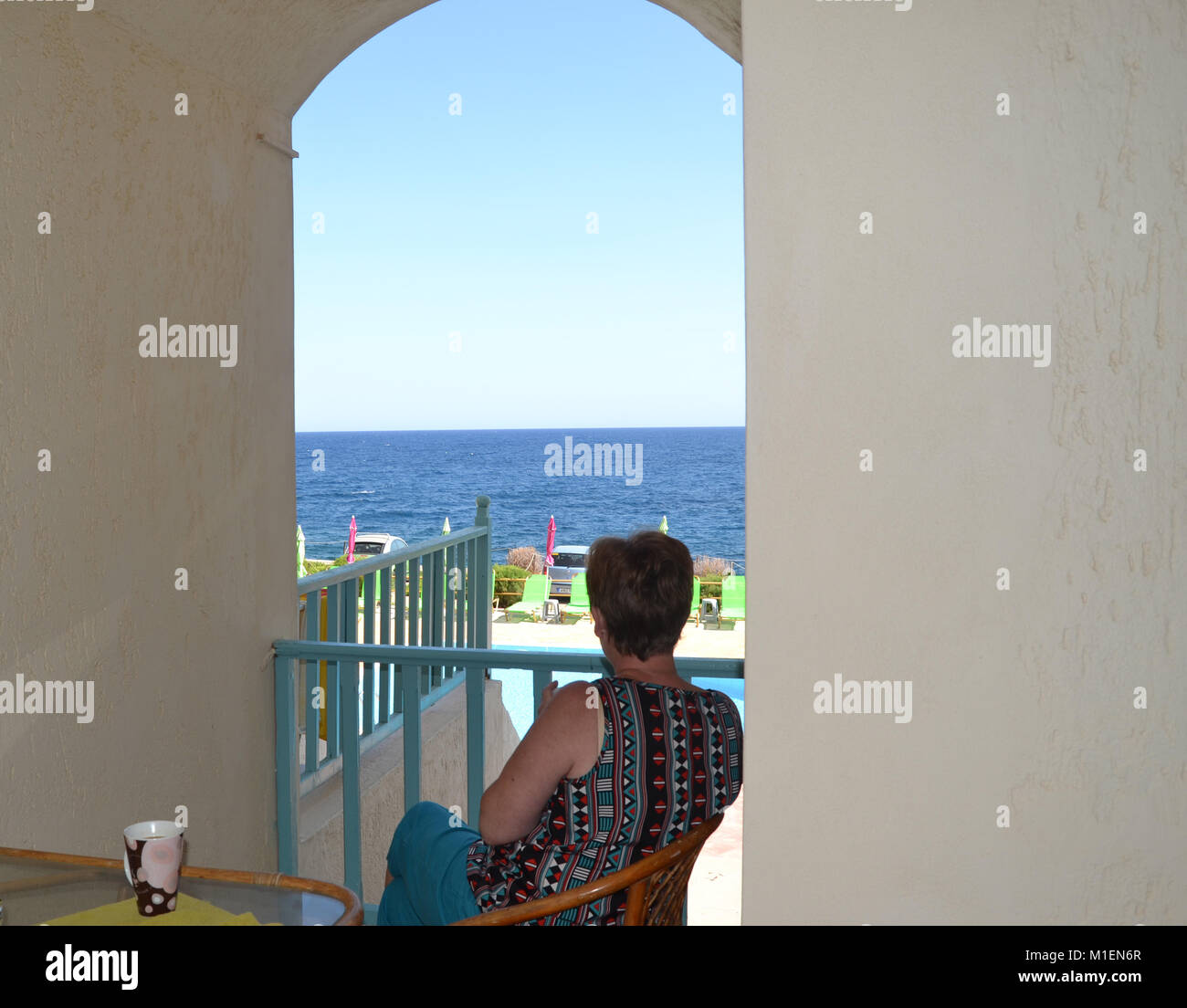 Cozy woman on balcony hi-res stock photography and images - Alamy