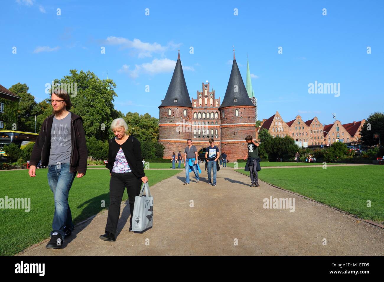 LUBECK, GERMANY - AUGUST 29, 2014: People visit Hostentor gate in ...