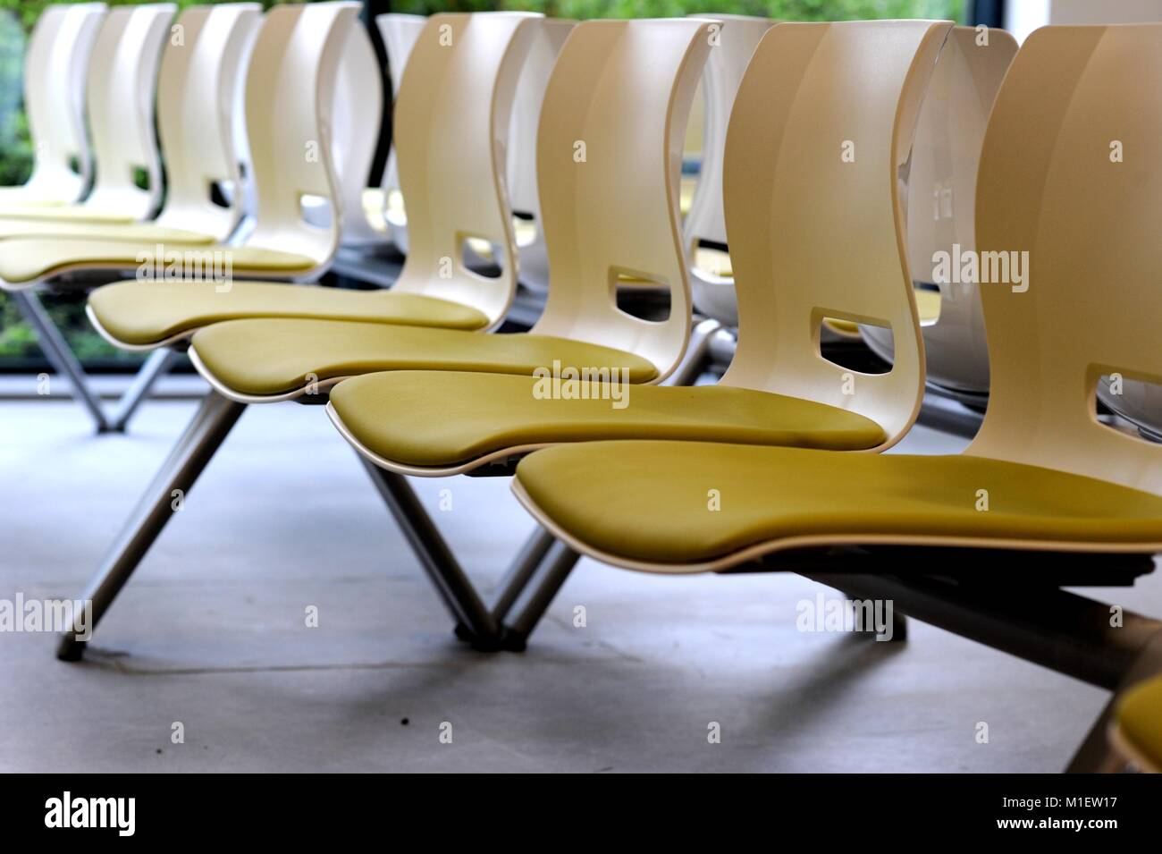Chairs in a row in medical center reception Stock Photo - Alamy