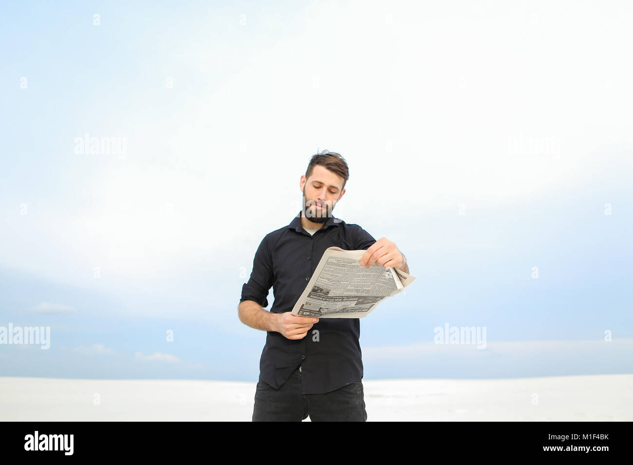 doctor reading newspaper in countryside Stock Photo - Alamy