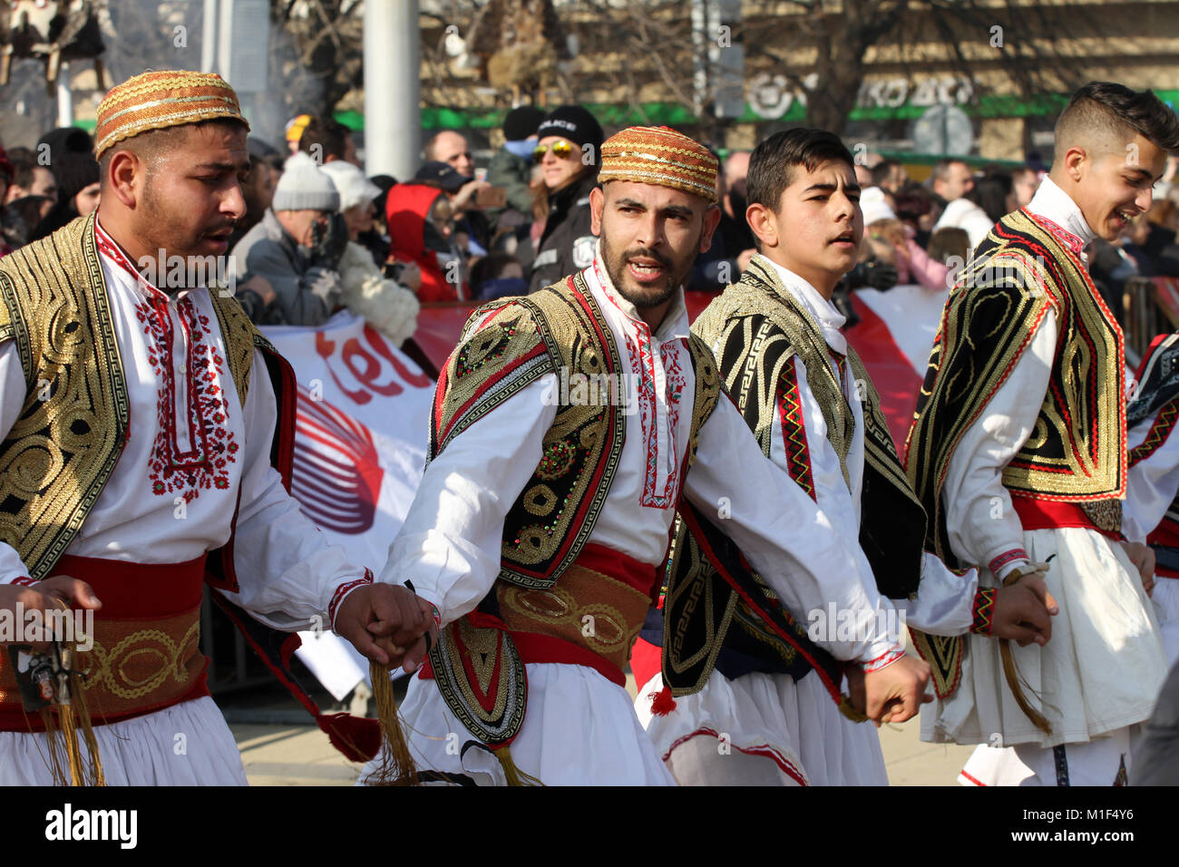 Folklore ensemble with traditional costumes dance horo with ritual ...