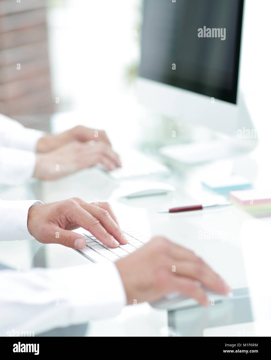 hands typing text on the computer keyboard. blurred business background Stock Photo - Alamy
