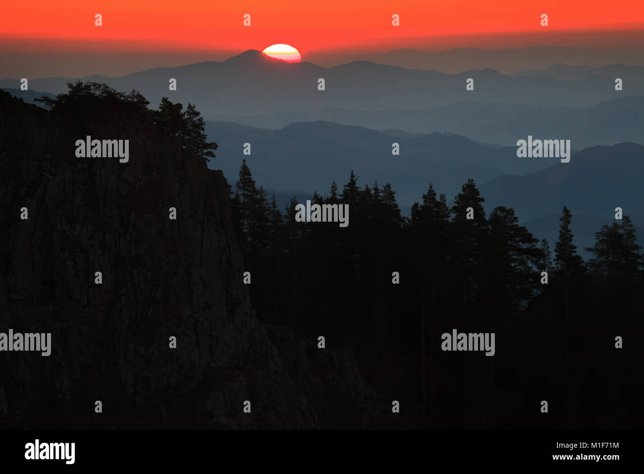 sun rise above the rocky mountains Stock Photo - Alamy
