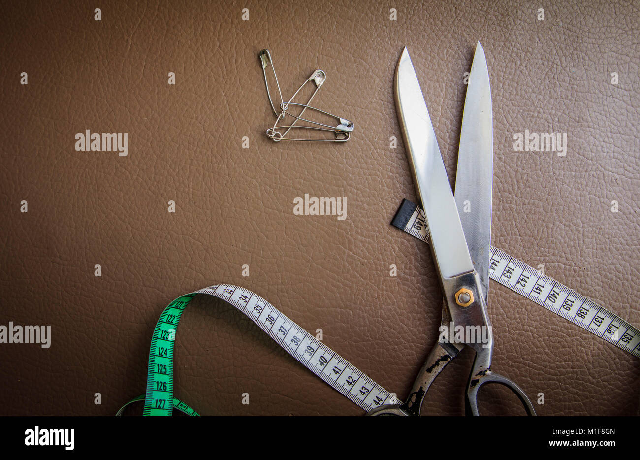 Tailor scissors tape measure suit hi-res stock photography and images ...